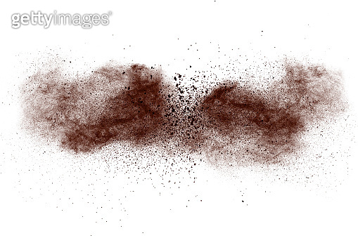 coco color particles splatter on white background. Deep brown dust ...