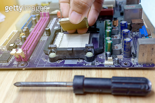 Computer repairs install processor into the motherboard socket for desttop (pc) By technician on ...