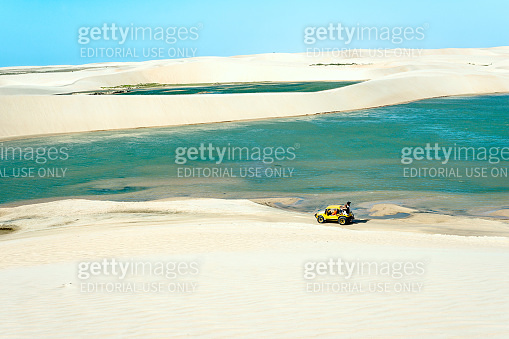 Buggy with tourists traveling through the desert Jericoacoara National ...