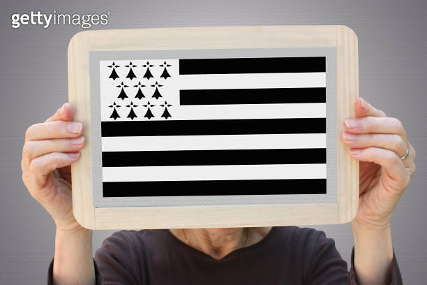 Bretagne "Breizh" Emblem Breton flag Table held with raised arms by a ...