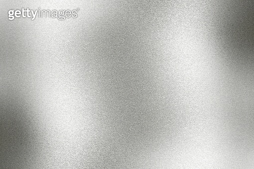 Light shining on old silver metallic wall, abstract texture background ...