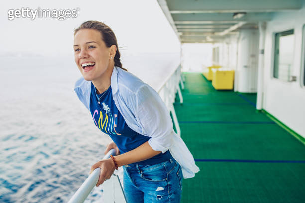 Cheerful Young Woman Reaching her destination with a Ferry boat 이미지 ...