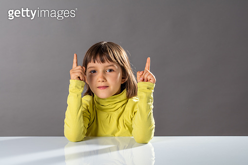 joyous cheeky child enjoying raising his fingers for fun answers 이미지 ...