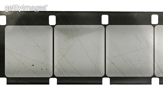 long 16mm film or movie strip with empty frames or cells on white ...