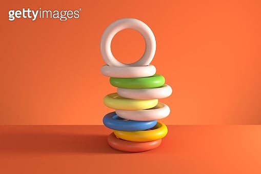 Pile of random shifted colorful tori (torus shape) isolated on orange ...