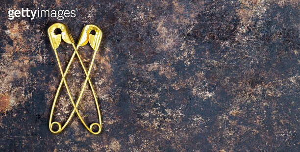 Business success and relationship concept, two safety pins, web banner ...