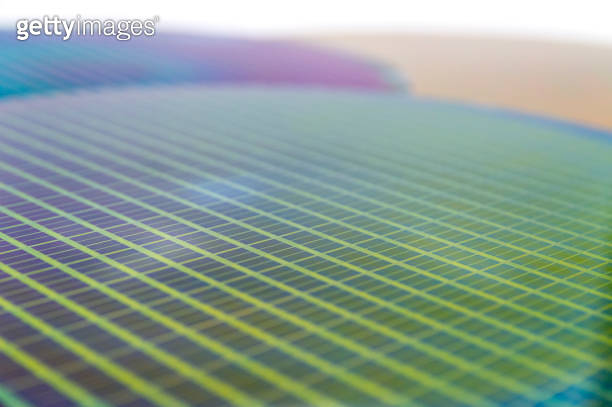 Three Multicolored Patterned 12 Inch 300 mm Silicon Wafers On a White ...