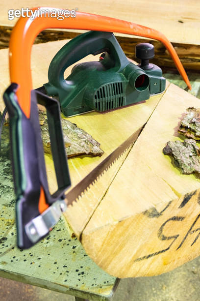 Joiner's workshop. Sawed logs lie on the table and a carpentry tool ...