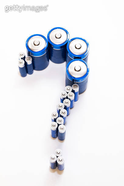 Question mark made of rechargeable batteries. Question mark on a white ...