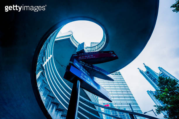 street signs under spiral stairs in Hong Kong (1141662333) - 게티이미지뱅크