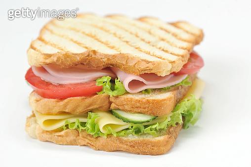 Club sandwich of fried white bread. The filling of the sandwich ...