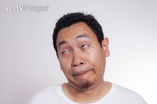 Funny Asian Man Lazy Bored Mocking Face 이미지 (1151058810) - 게티이미지뱅크