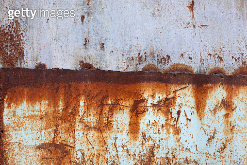 Bright rust stains texture paint showing through to rust underneath ...