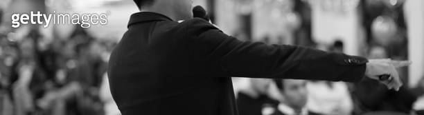 Speech given by professional speaker on stage at corporate conference ...