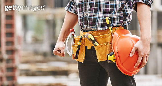 Safe work. Cropped photo of male professional builder with construction ...