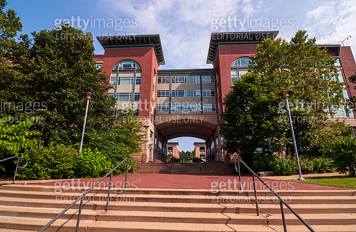 A set of steps leading to a covered walkway between buildings on the ...