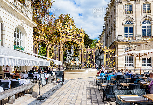 Fountain of Amphitrite and sidewalk restaurant on the place Stanislas ...