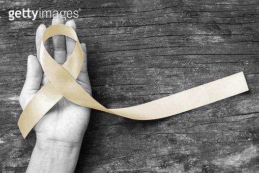 Cream awareness ribbon on helping hand support symbolic bow color for ...