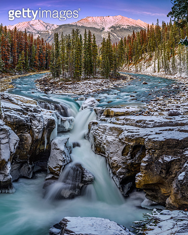 Panoramic format photo of the early winter scene at Sunwapta Falls on ...