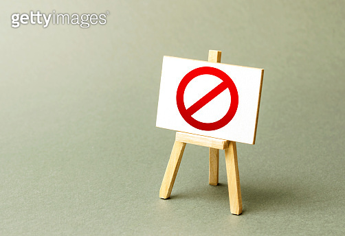 Stand with a canvas and a red prohibition sign NO. Inability to sell ...
