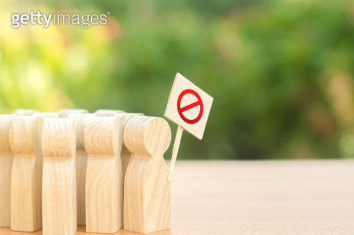 A crowd of people with posters protesting. An angry mob of wooden ...