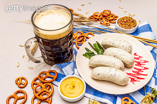 Beer Fest set. Dark beer, weisswurst, pretzels, mustard, spikelets of ...
