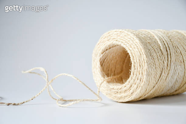 Linen roll yellow white string object on white background, Natural ...