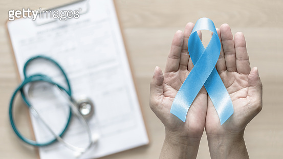 Blue ribbon for prostate cancer awareness and men's health care concept ...
