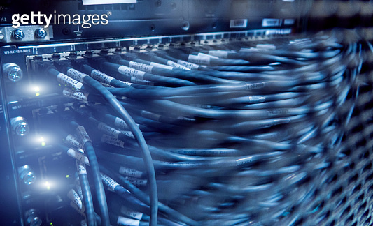 Modern Network panel, switch and lan cable in data center server room ...