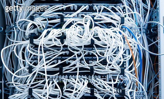 Modern Network panel, switch and lan cable in data center server room ...