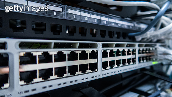 Modern Network panel, switch and lan cable in data center server room ...