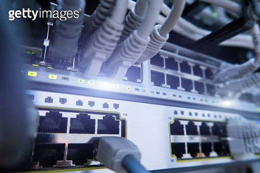 Modern Network panel, switch and lan cable in data center server room ...