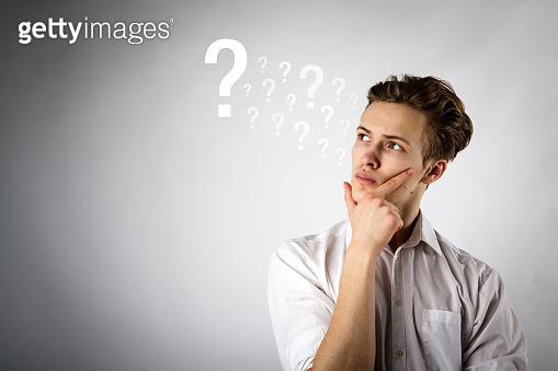 Young man is full of doubts and hesitation. Young man and Question ...