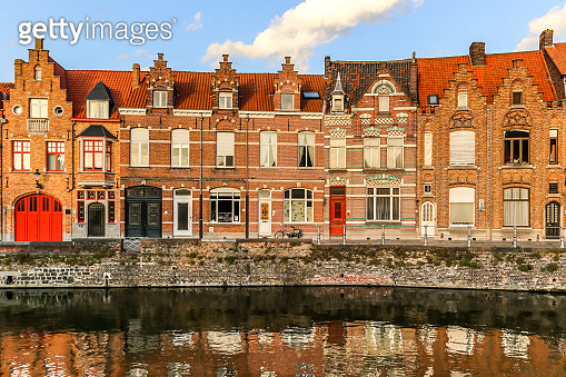 Traditional belgian buildings (houses) along the Langerei canal in ...
