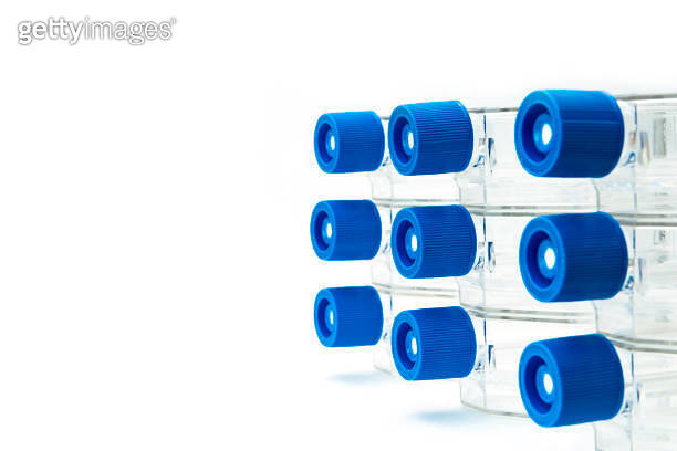 Stack of tissue cell culture flasks with vent cap for scientific ...