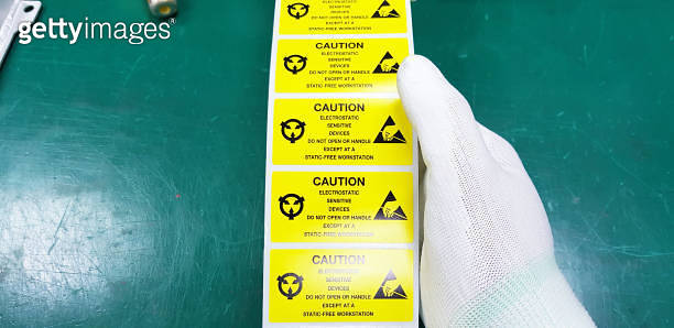 Hand holding ESD symbol label with antistatic gloves,Electrostatic ...
