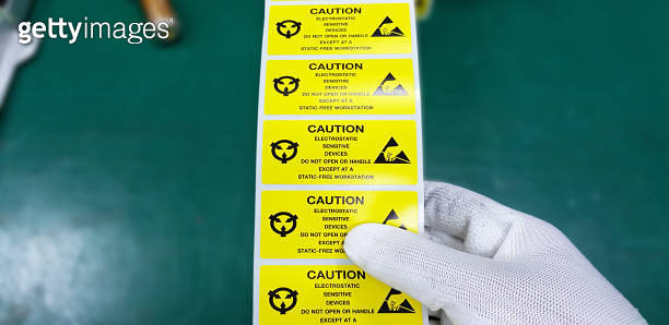 Hand holding ESD symbol label with antistatic gloves,Electrostatic ...