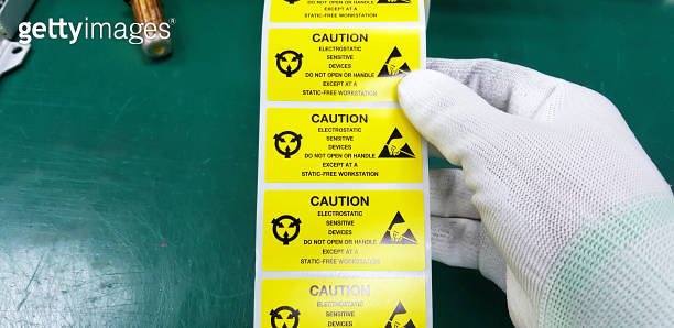 Hand holding ESD symbol label with antistatic gloves,Electrostatic ...