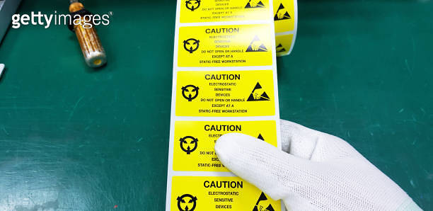Hand holding ESD symbol label with antistatic gloves,Electrostatic ...