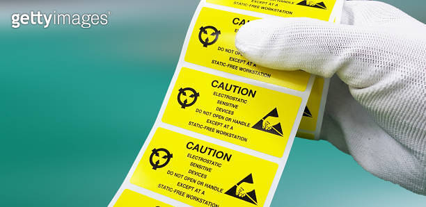 Hand holding ESD symbol label with antistatic gloves,Electrostatic ...