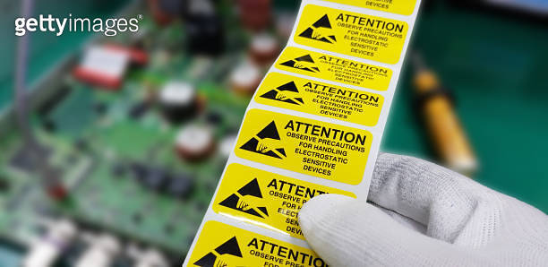 Hand holding ESD symbol label with antistatic gloves,Electrostatic ...