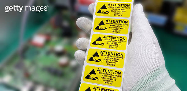 Hand holding ESD symbol label with antistatic gloves,Electrostatic ...