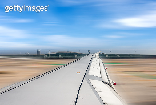 Airplane running on the airport runway - Blurred motion (1131959846 ...