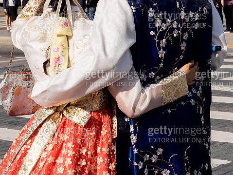 Young couple in colorful traditional wear - hanbok. Close-up view from ...