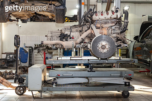 Replacement engine used on a table mounted for installation on a car ...