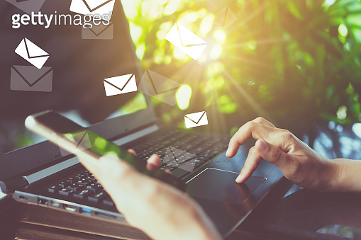 Woman hand using smartphone to send and recieve email for business on ...