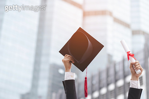 shot of backside young male graduation hats during commencement success ...