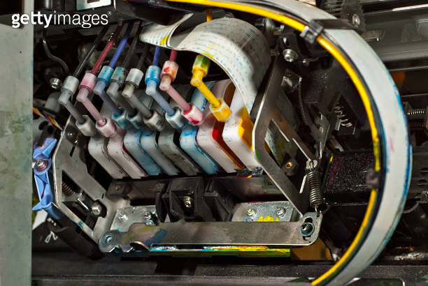 The printer is disassembled into parts. Broken, dirty and dusty printer ...