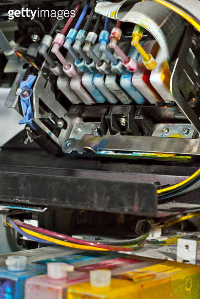 The printer is disassembled into parts. Broken, dirty and dusty printer ...