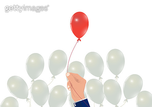 Hand picking red balloon from white balloons, business concept of ...